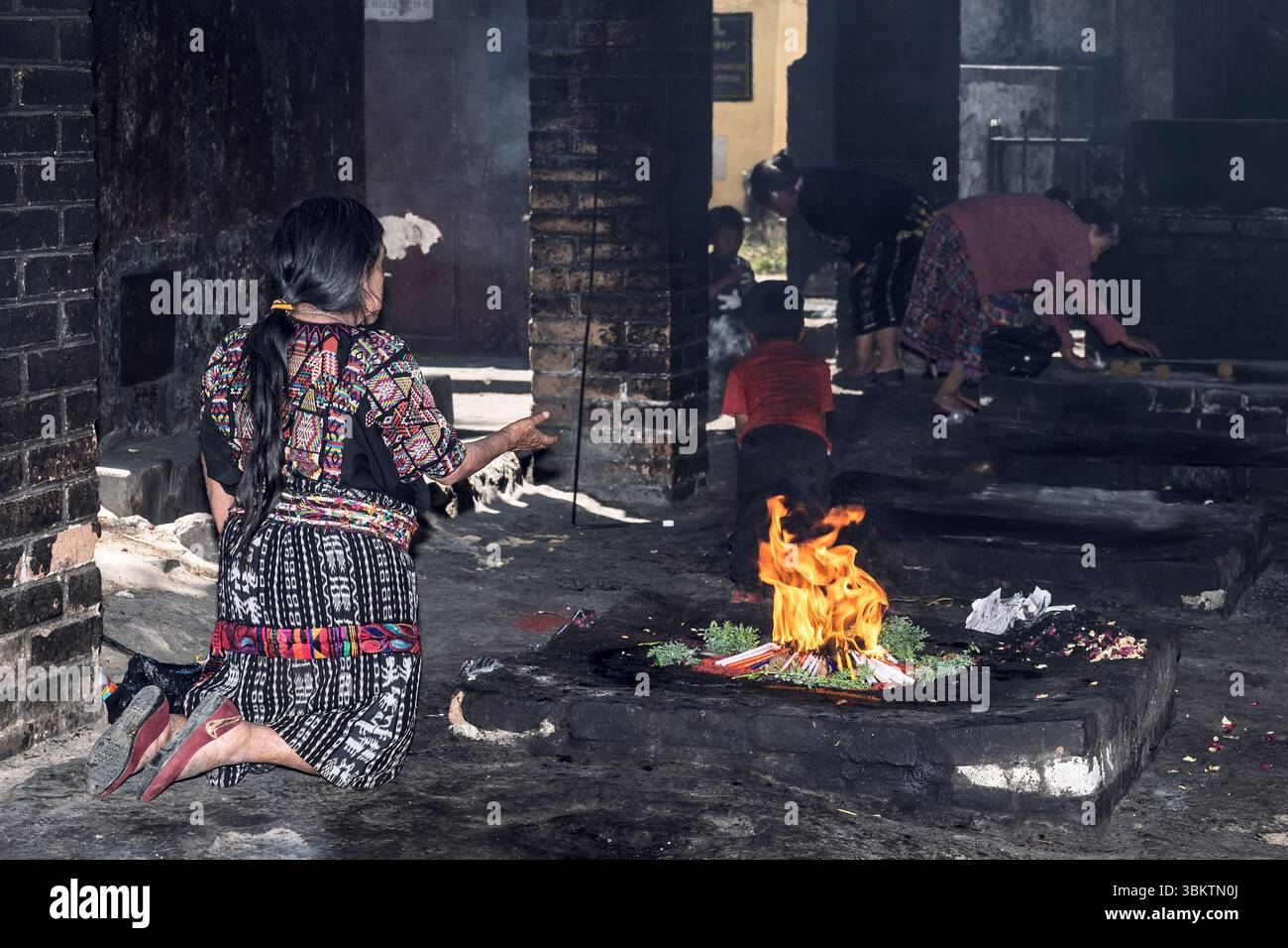 Mayan ceremony by locals, ritual items inc candles, liquor, gigars ...