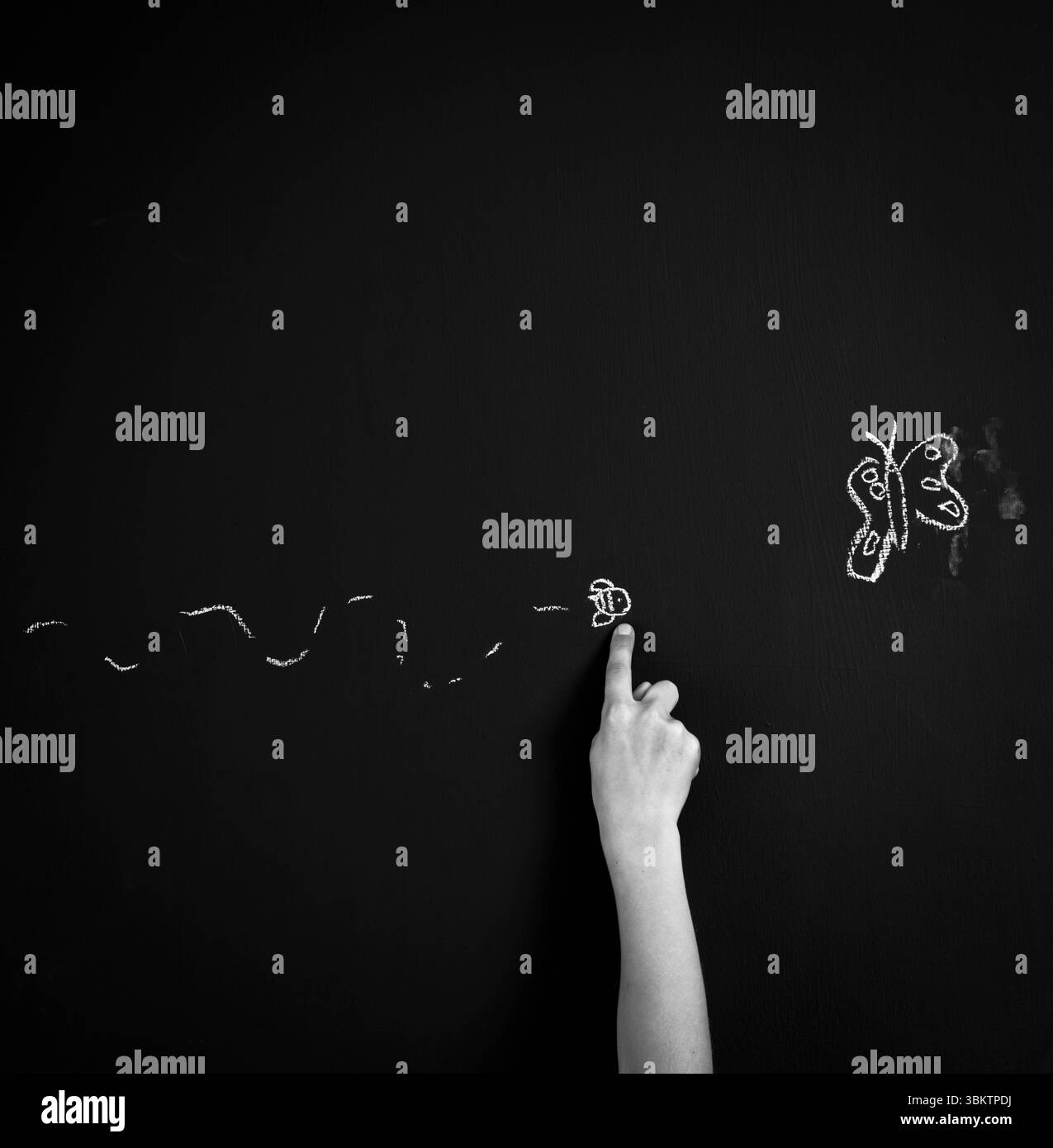 Girl pointing blackboard Black and White Stock Photos & Images - Alamy