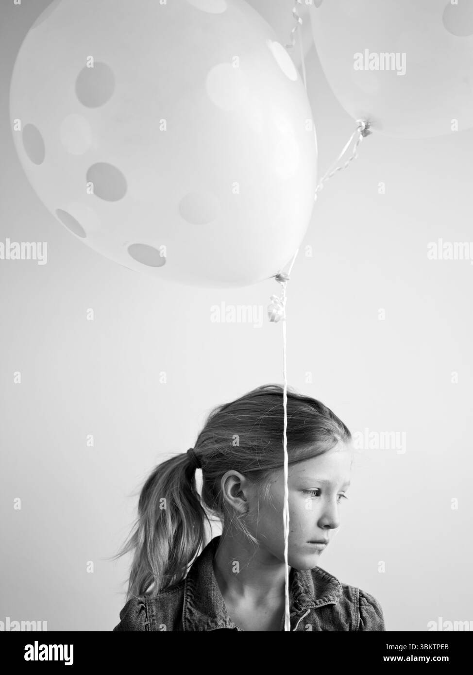 Girl in jacket holds Black and White Stock Photos & Images - Alamy