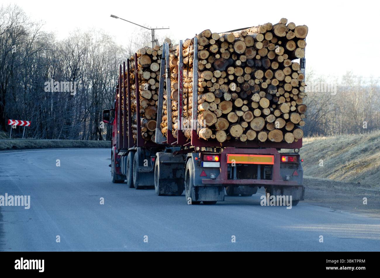 Truck transporting timber on a highway Stock Photo - Alamy