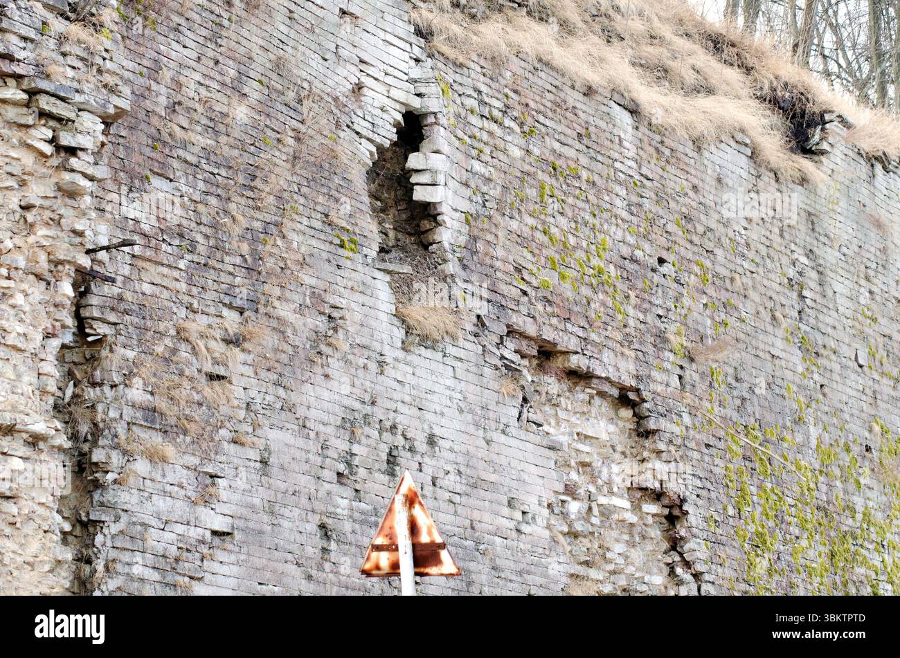 Damaged stone wall with erosion Stock Photo - Alamy