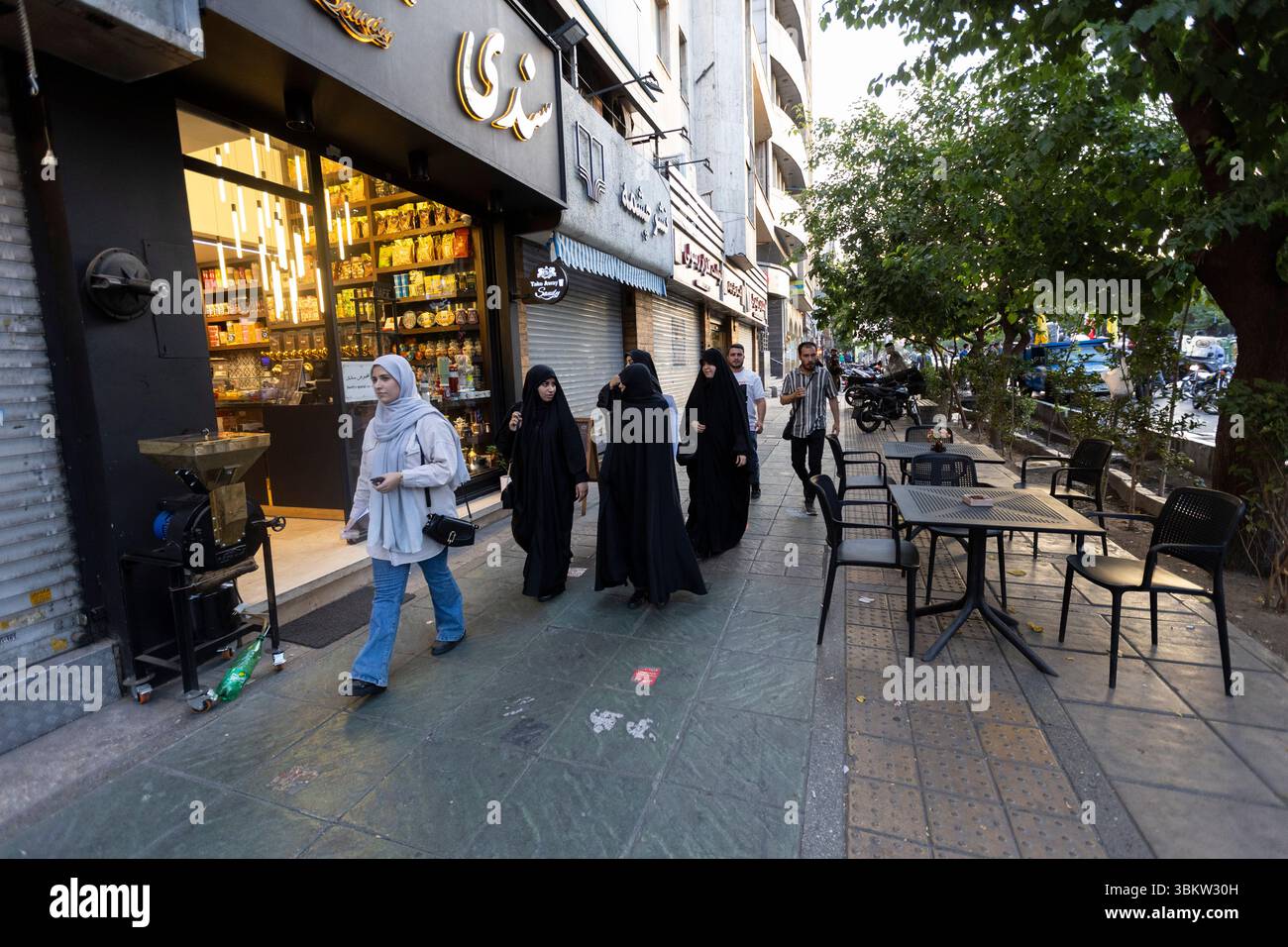 June 22, 2025, Tehran, Tehran, Iran: People walk past a cafÃ©, one day ...