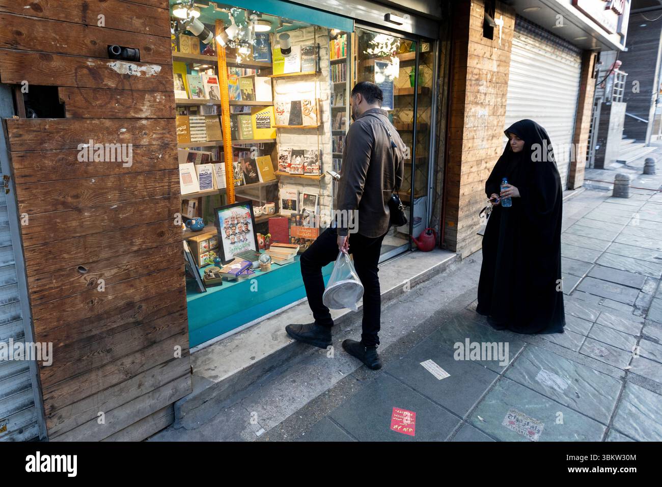 Tehran, Tehran, Iran. 22nd June, 2025. A man stands in front of a ...