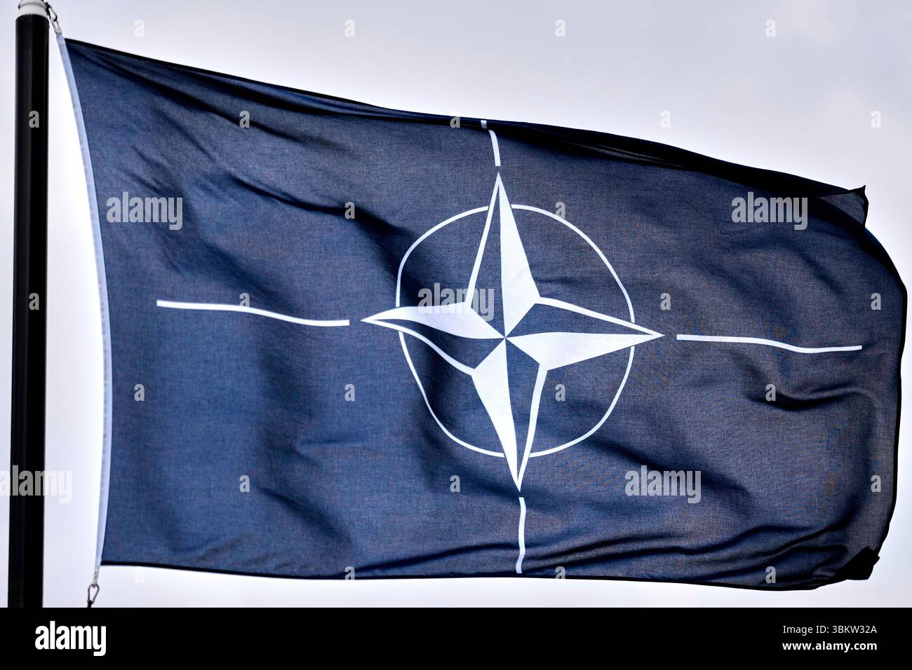 The NATO flag waves in the wind in front of the venue ahead of the ...