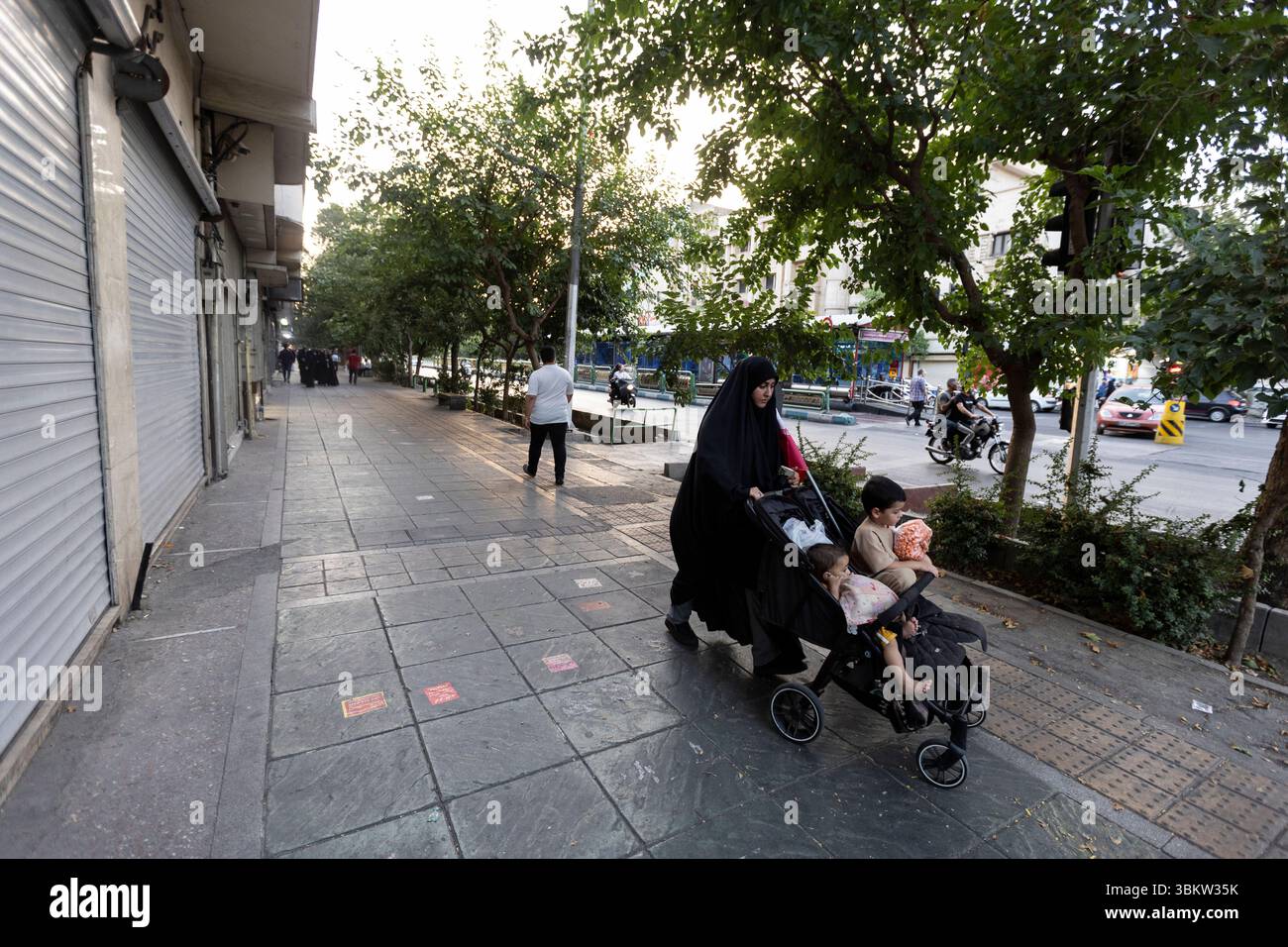 June 22, 2025, Tehran, Tehran, Iran: a woman walks down the street, one ...