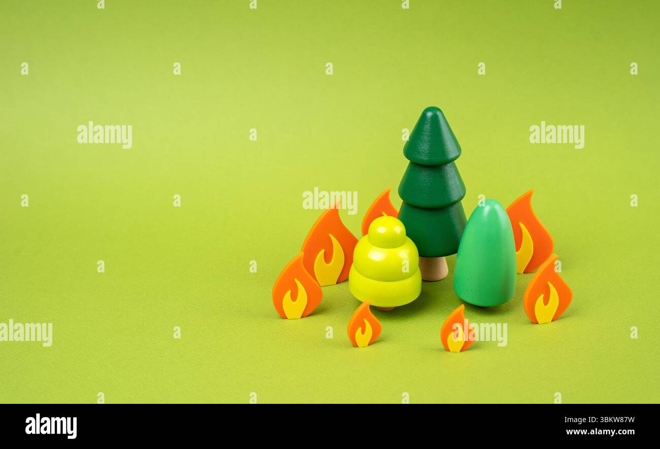 Forest on fire, metaphor from figurines. Preservation of forest and ...
