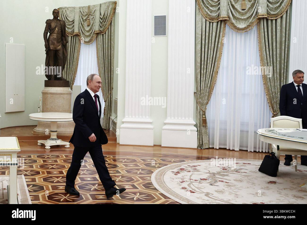 Russian President Vladimir Putin, left, arrives to attend the meeting ...