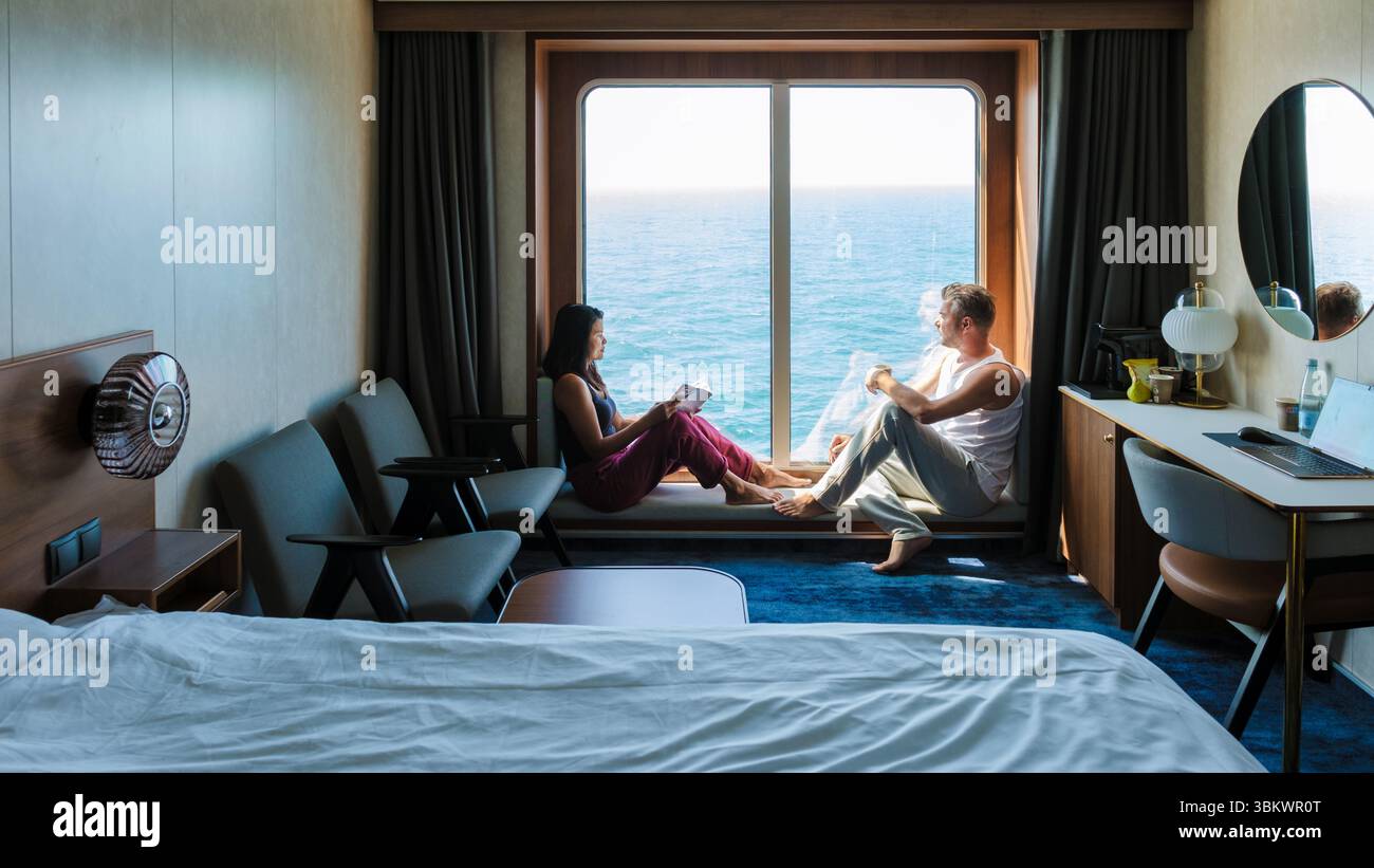 A couple enjoys quality time together in a stylish cabin with panoramic ...