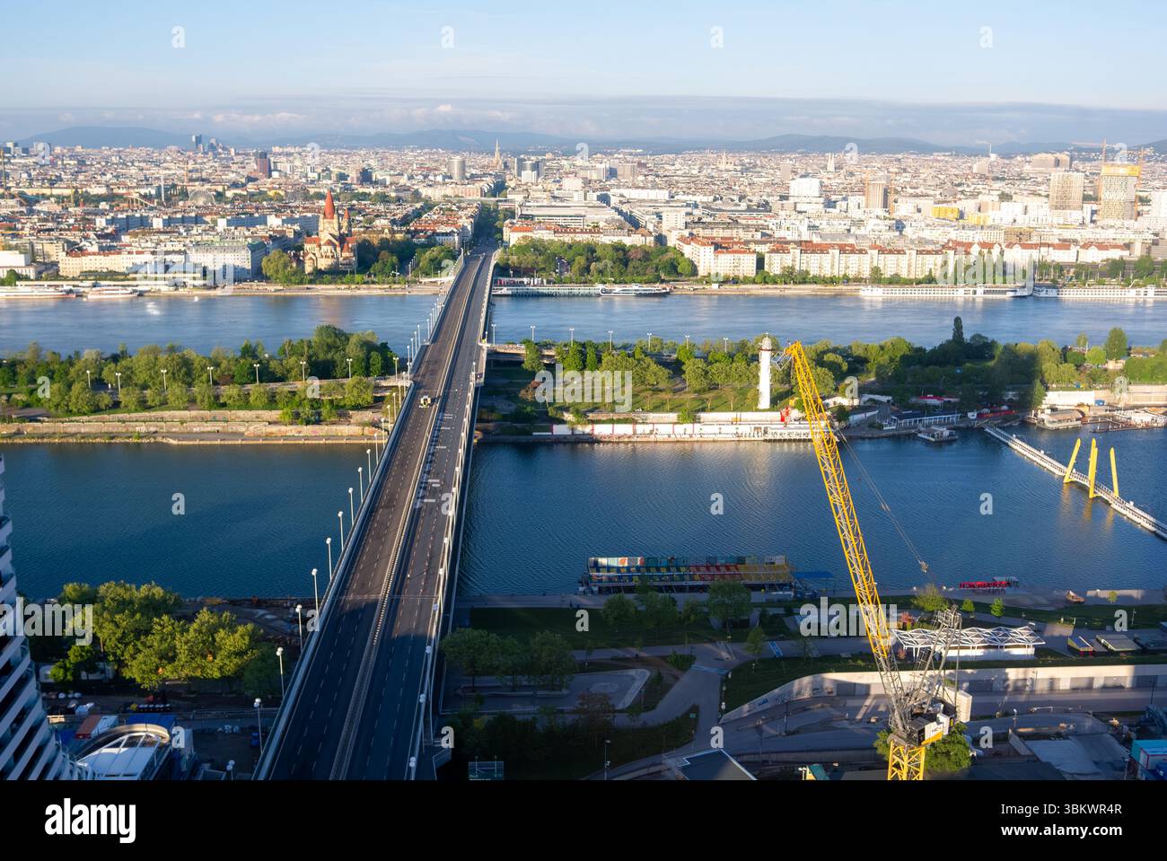 Sunrise over Vienna: Danube River, Reichsbrücke bridge, and a ...