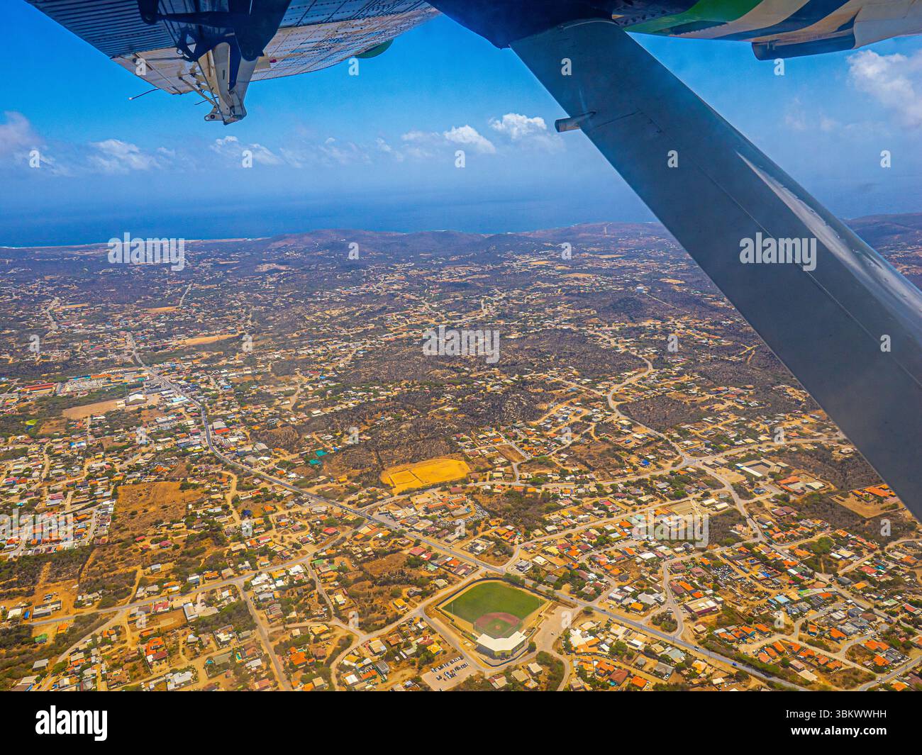 Aerial view from a small plane over Curaçao showing the coastline ...