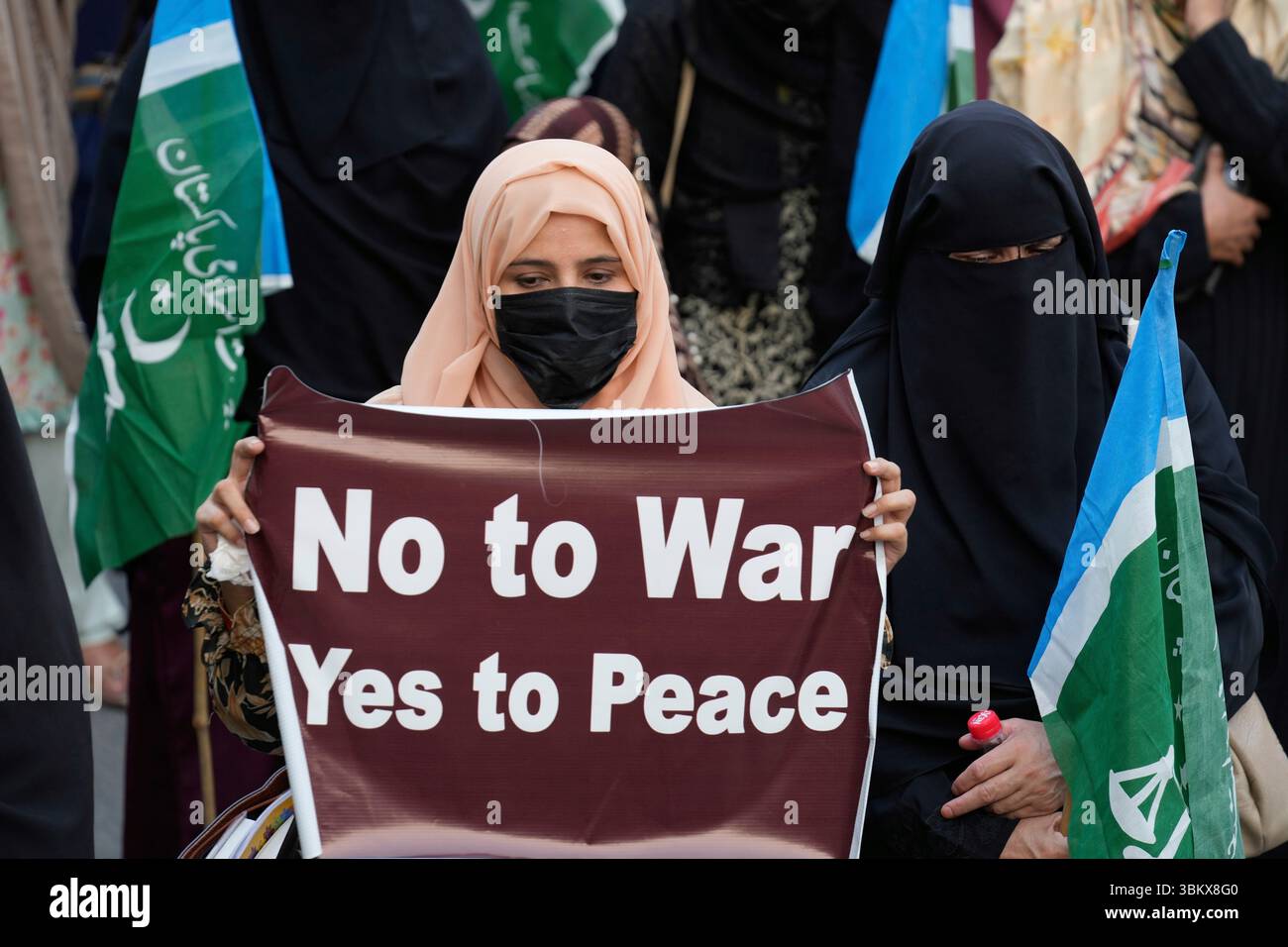 Supporters of the Pakistani religious party Jamat-e-Islami hold a ...