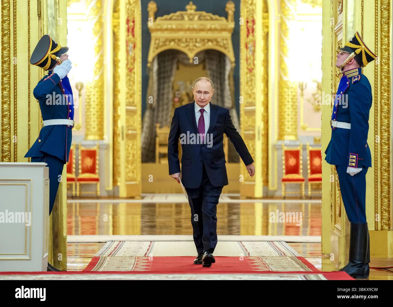 Russian President Vladimir Putin enters a hall to attend a ceremony at ...