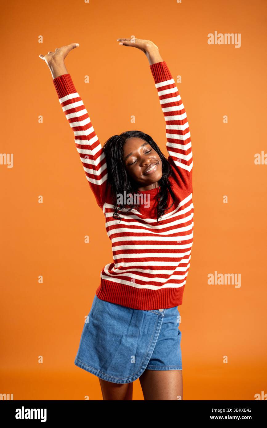 Female standing arms above head hi-res stock photography and images - Alamy