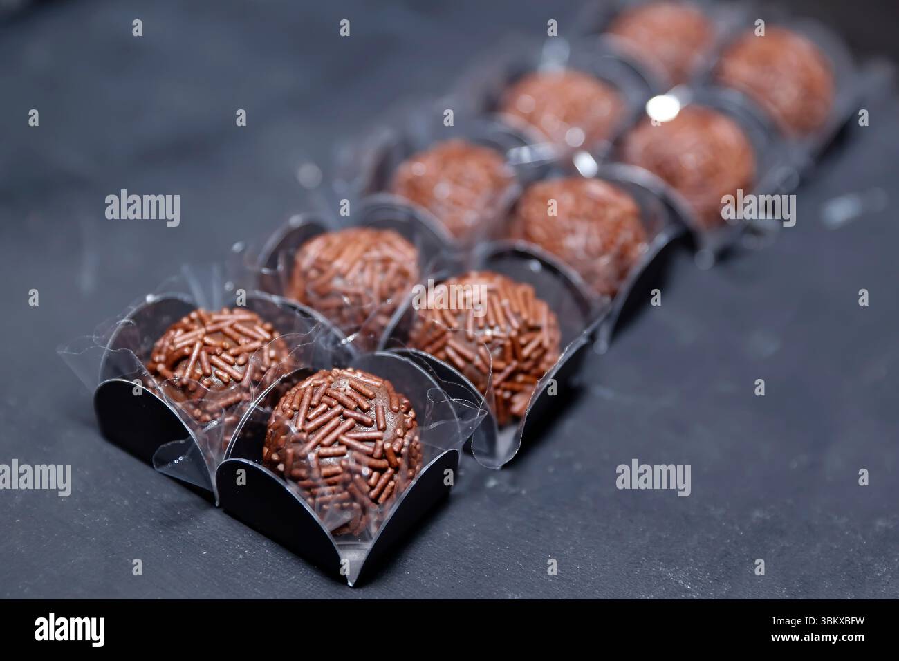 Diagonal close-up of creamy brigadeiro topped sprinkles, highlighting ...