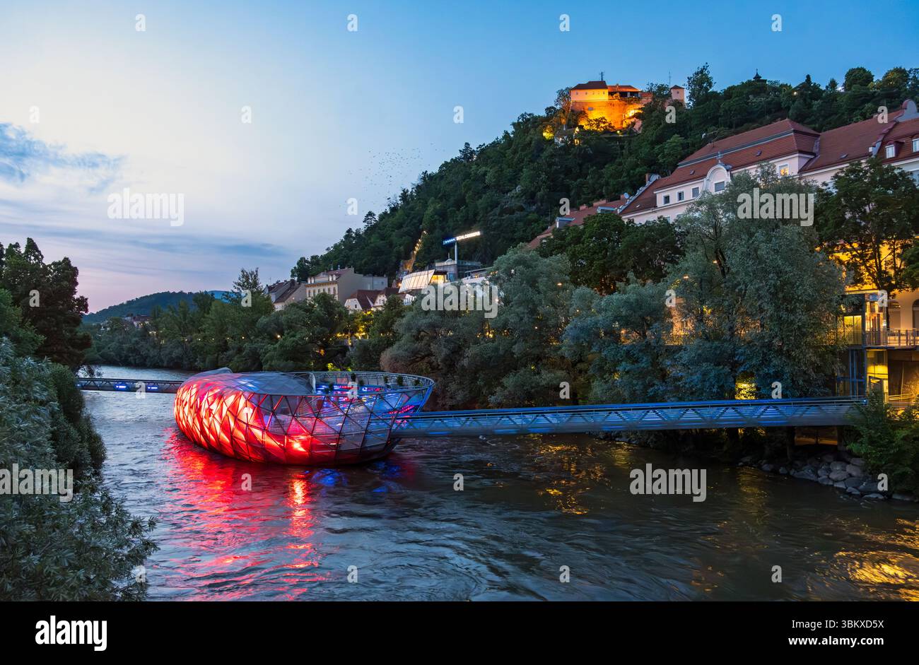 Night-time view of the Murinsel floating island on the river Mur with ...