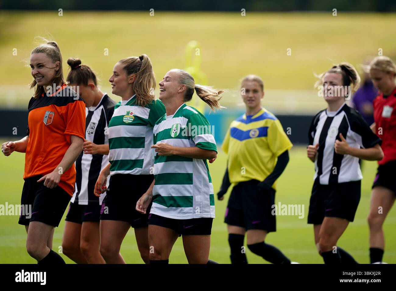 England warm up in football kits from their first team in football during a training session at ...
