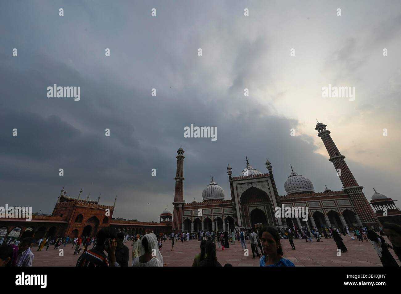 NEW DELHI, INDIA - JUNE 23: Dark cloud hover over the Jama Masjid on ...
