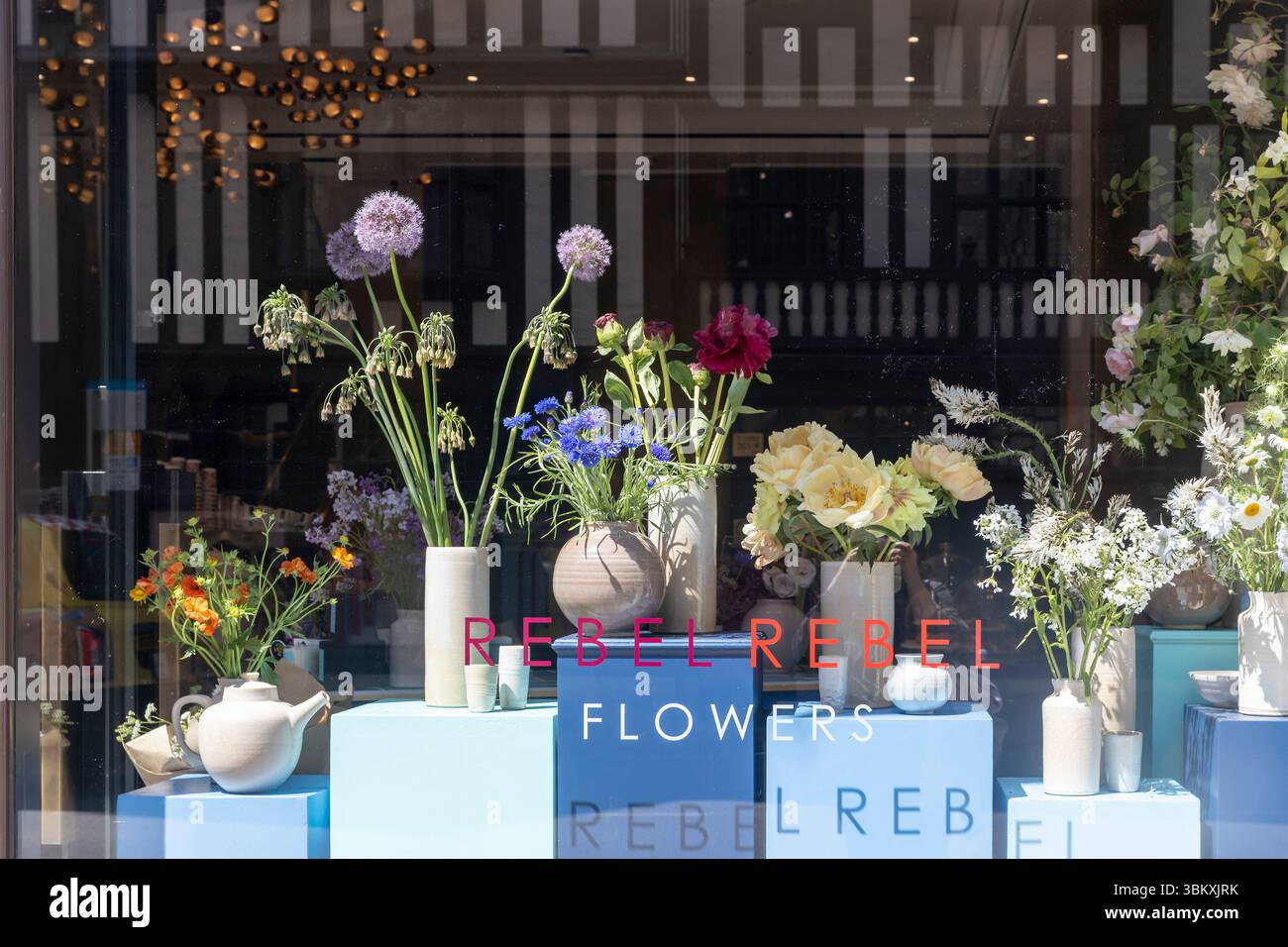 London, UK, 12 May 2025, Dynamic floral shop window display by Rebel ...