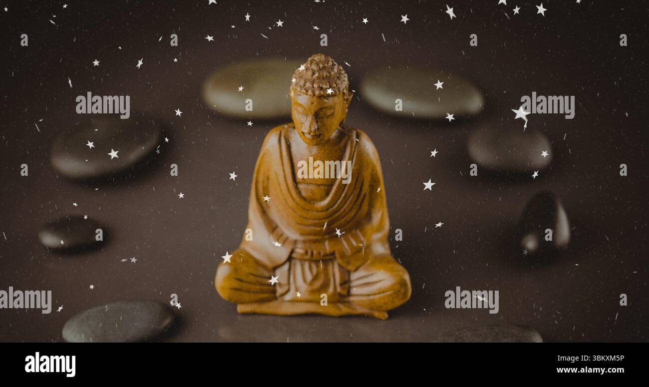 Displaying wooden meditating statue sitting on tabletop with river ...