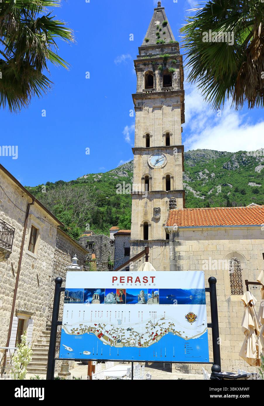 The town sign and Perast clocktower Stock Photo - Alamy