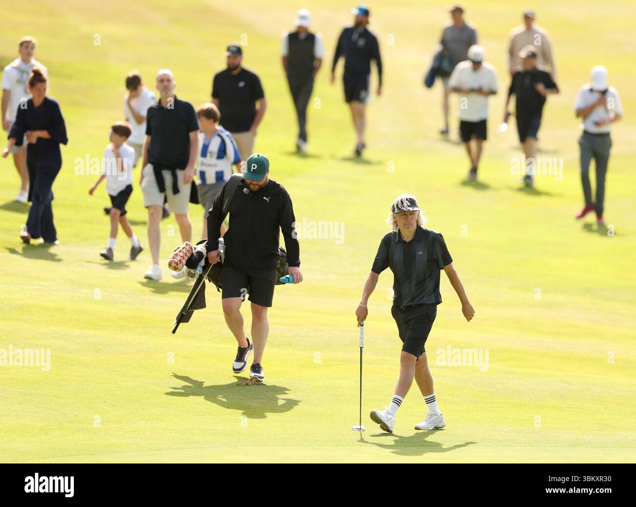Former Premier League footballer Jimmy Bullard walks up the 18th ...
