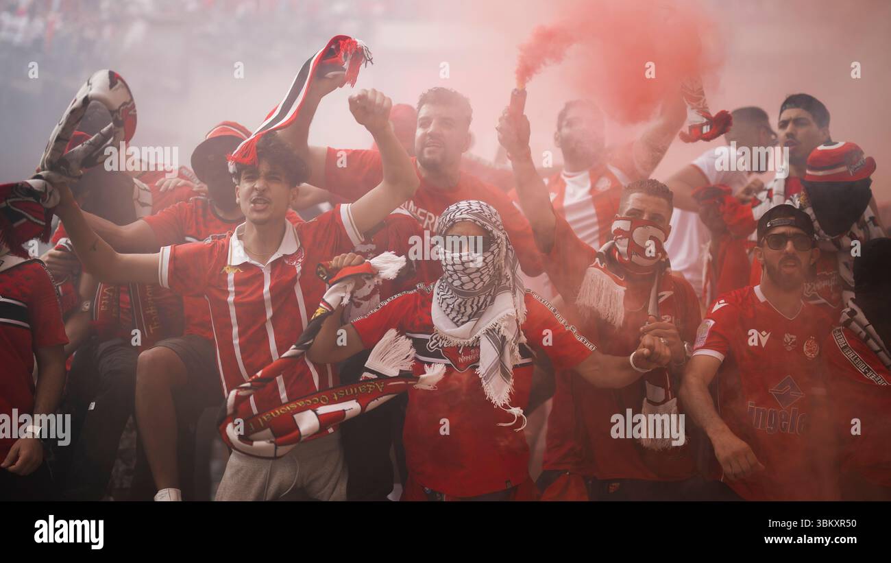 Fans of Wydad AC light flares and smoke bombs as they show their ...
