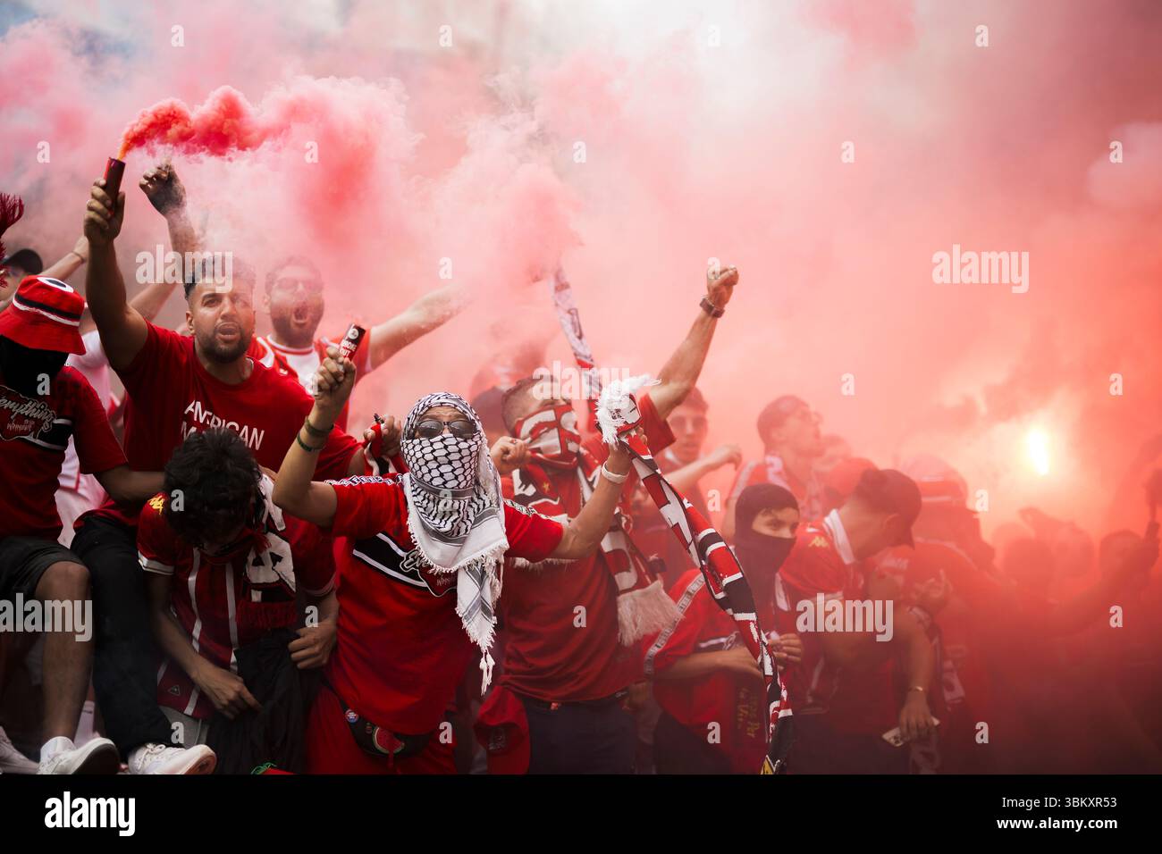 Fans of Wydad AC light flares and smoke bombs as they show their ...