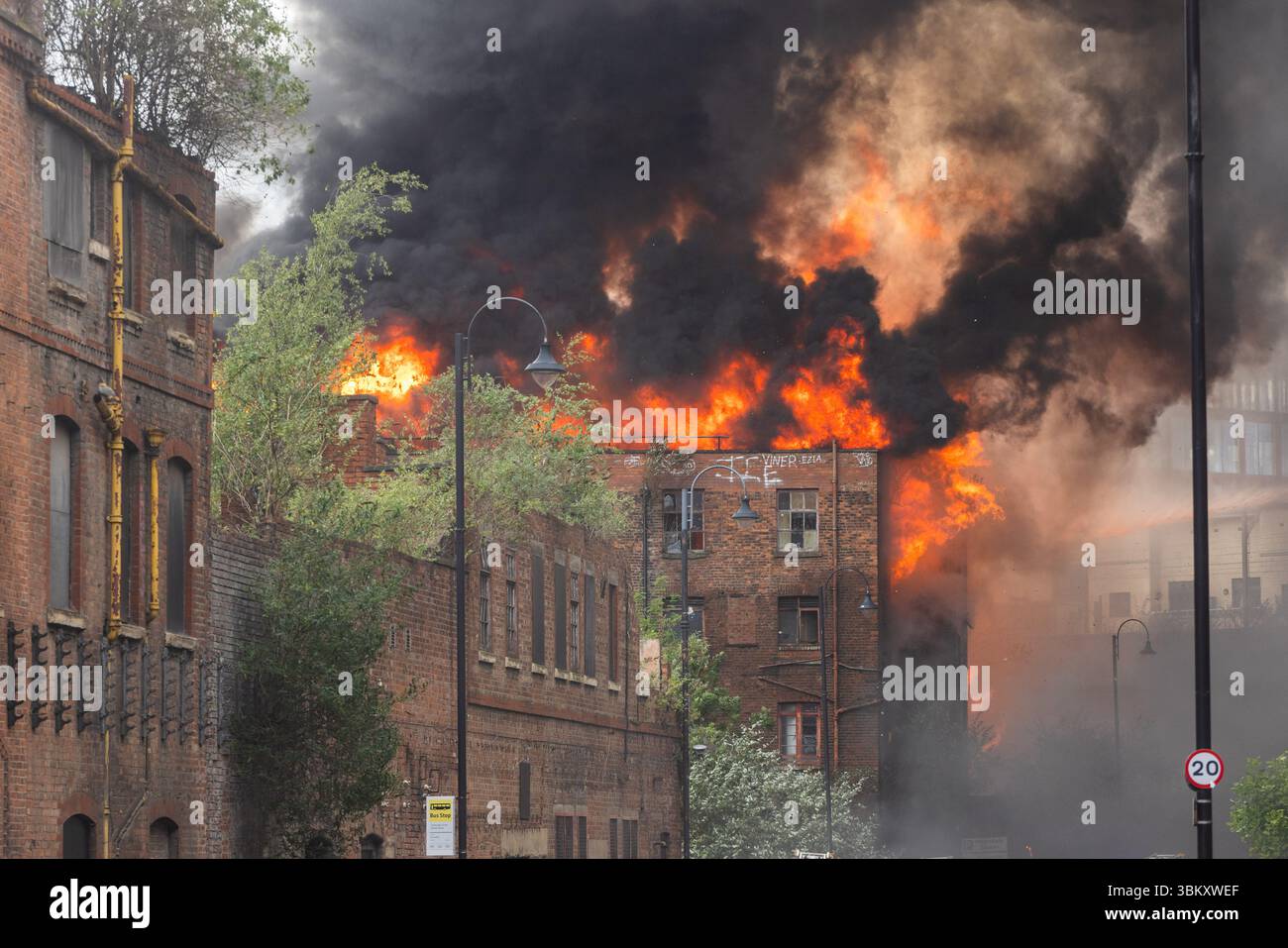 Manchester, UK. 23 JUN, 2025. Large fire engulfs the abandoned Hotspur Press mill building near ...