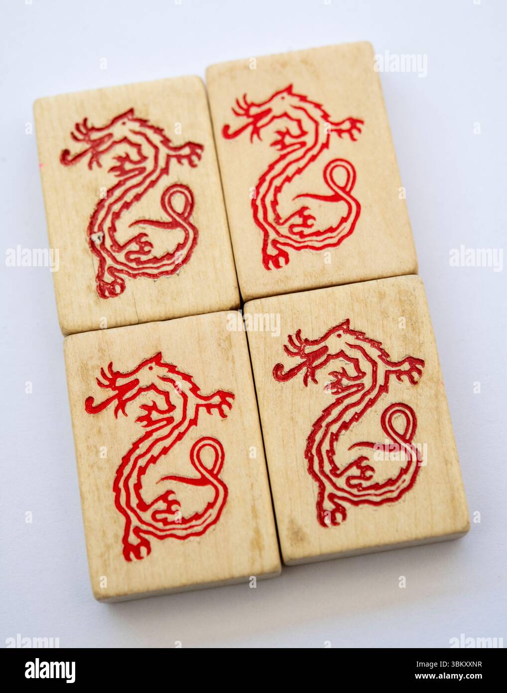Set of four red dragon tiles from a game of mahjong Stock Photo - Alamy