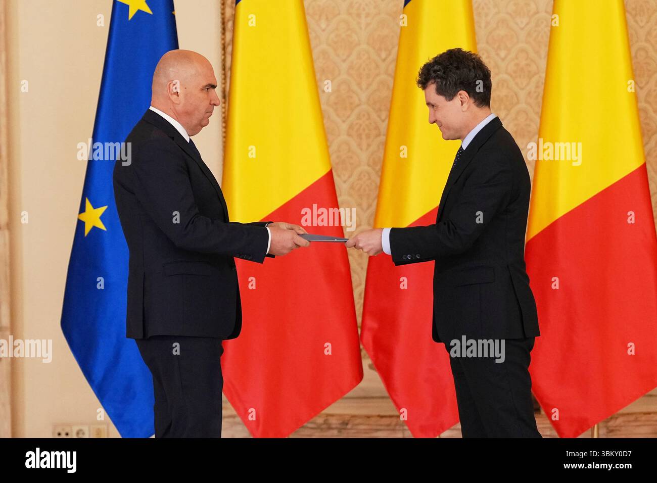 Romanian Prime Minister Ilie Bolojan hands his oath to Romanian ...