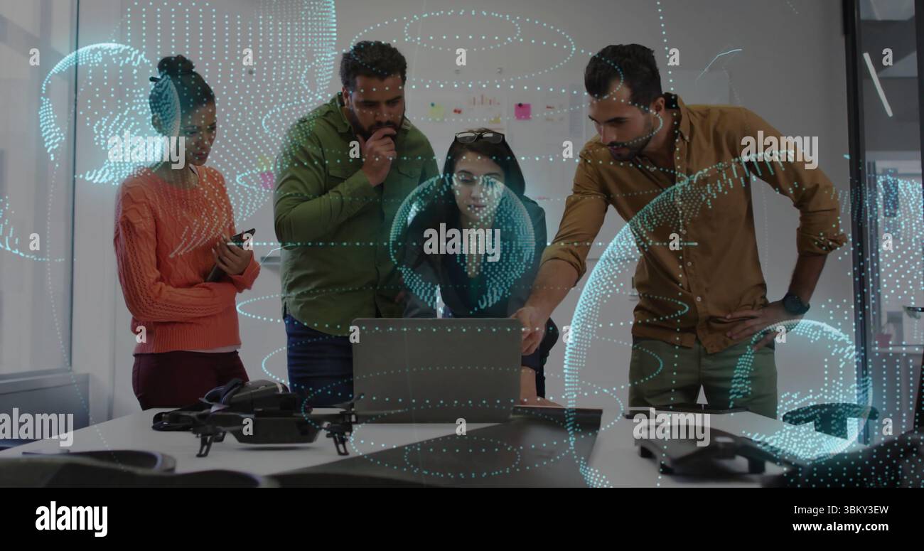 Analyzing digital globe with professionals around laptop in meeting ...