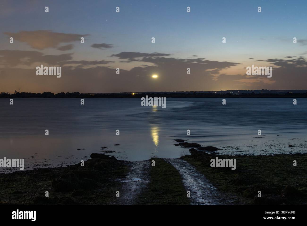 The lights of an aircraft taking off from Stansted Airport are ...
