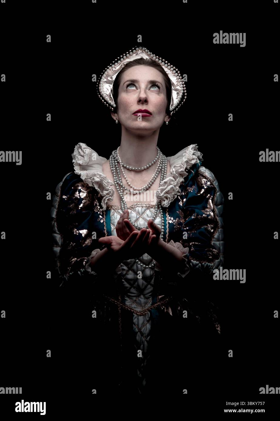 Woman looks up solemn hi-res stock photography and images - Alamy