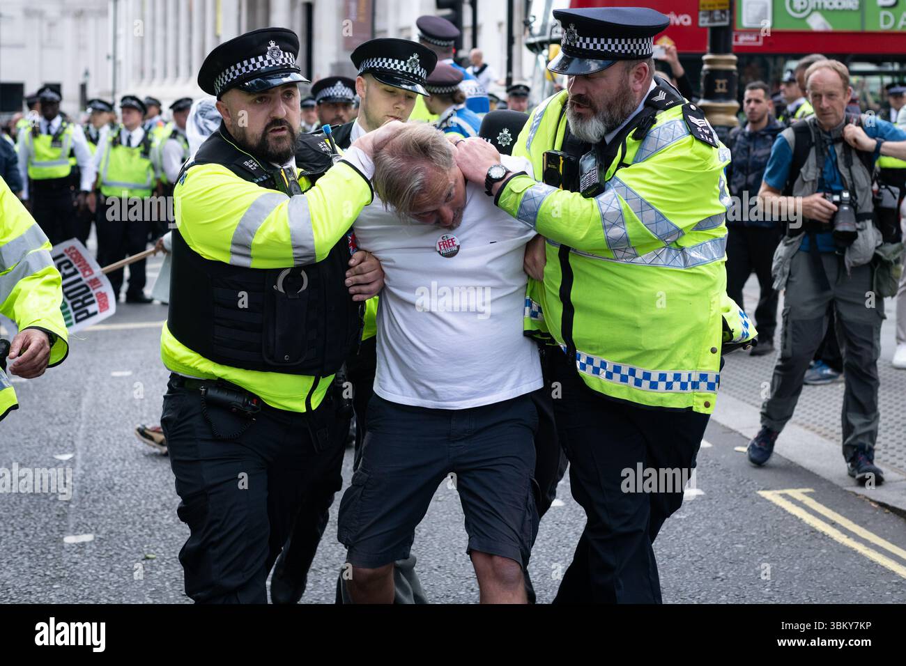 London, UK. 23 June, 2025. Police arrest a man as supporters of non ...