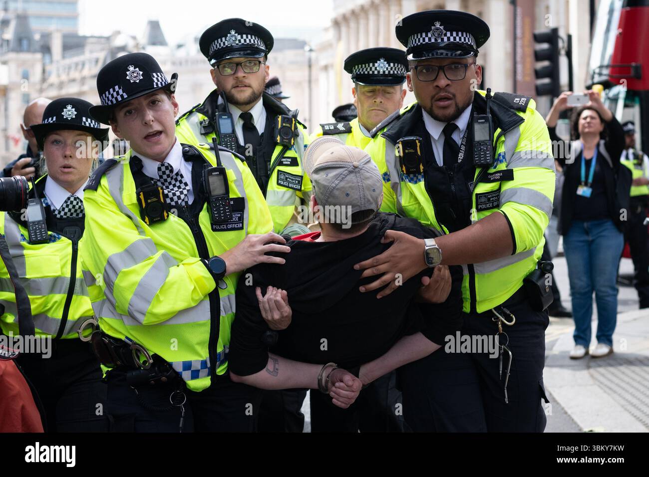 London, UK. 23 June, 2025. Police arrest a man as supporters of non ...