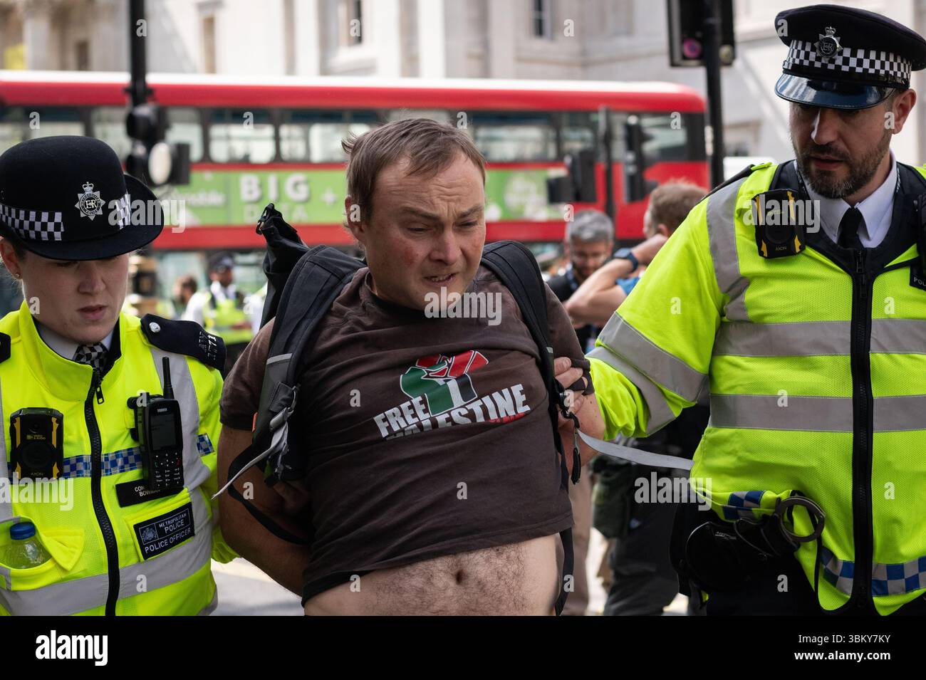 London, UK. 23 June, 2025. Police arrest a man as supporters of non ...