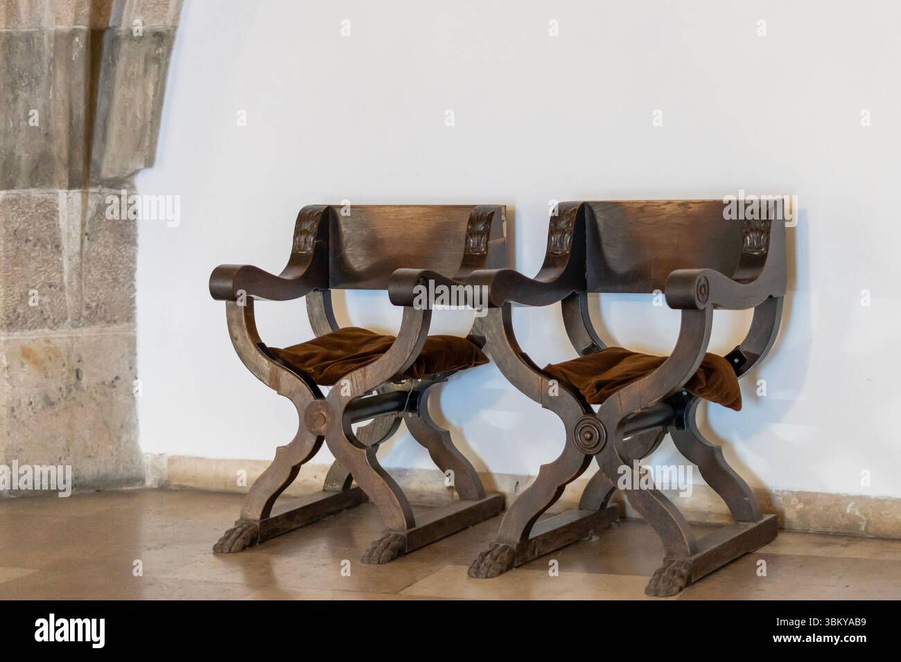 Vintage medieval style wooden chairs with carved details Stock Photo ...