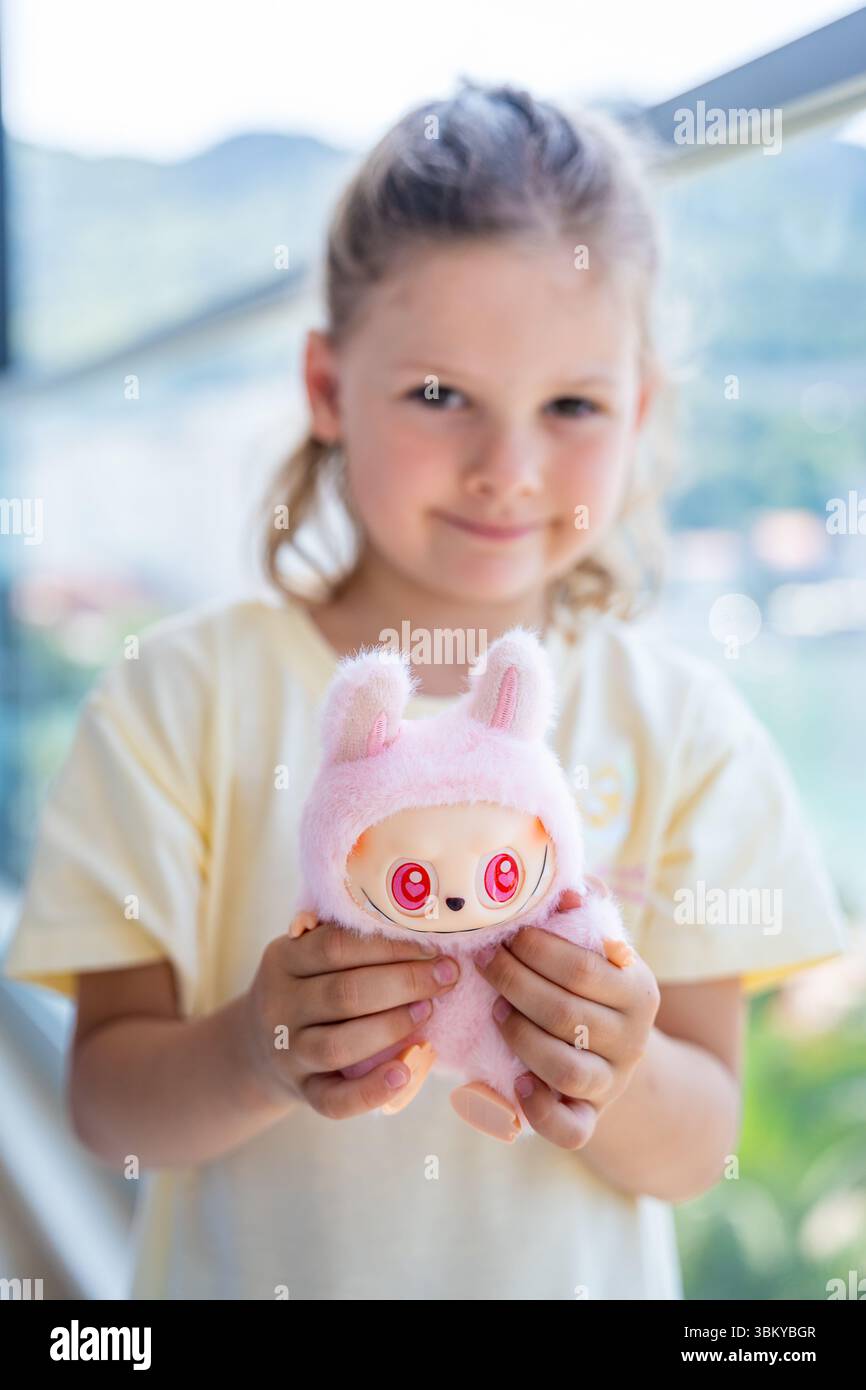 Budva, Montenegro - June 12, 2025: Close-up of pink Dada figure from ...