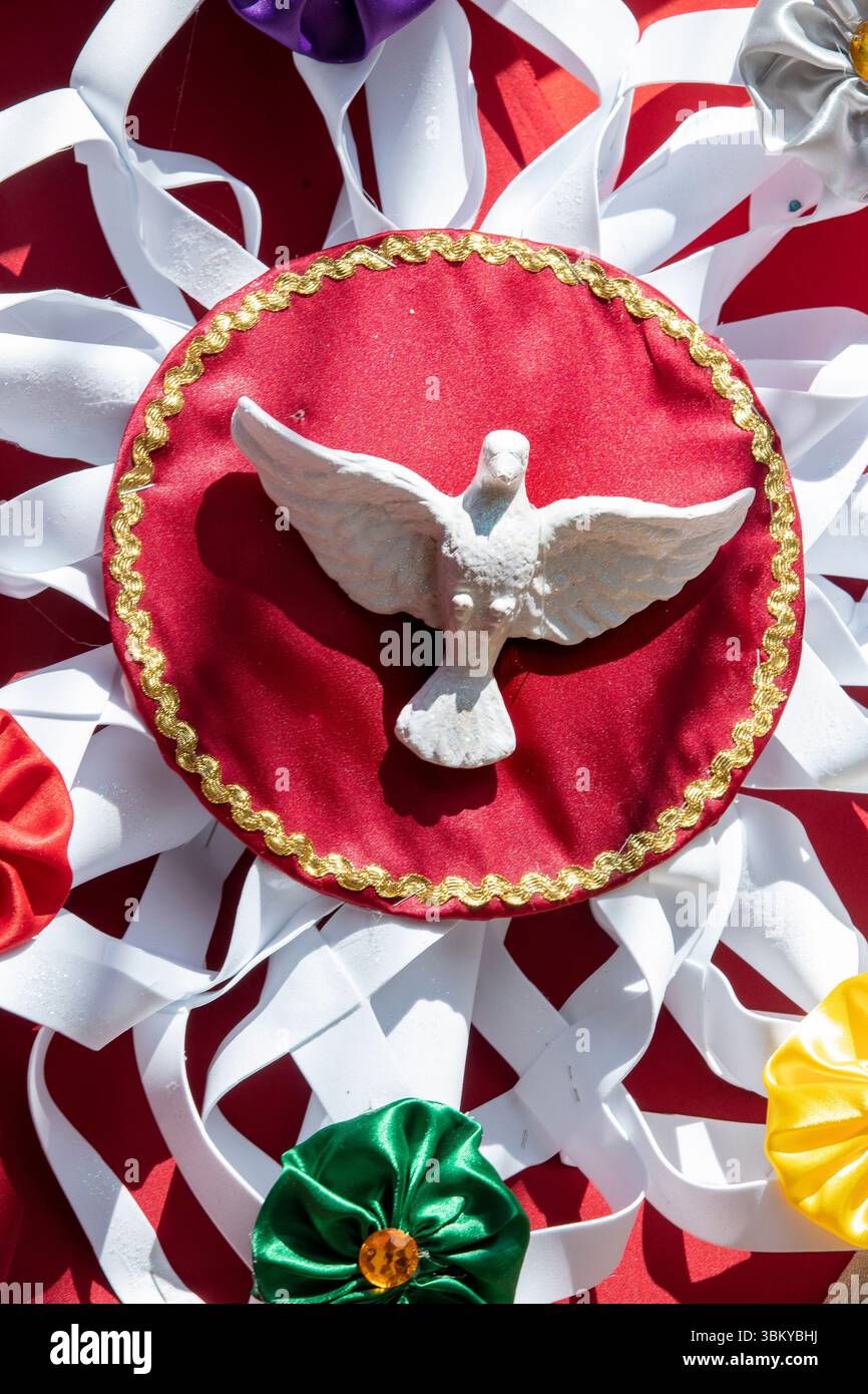 Symbol of the Holy Spirit, red with a white dove, adorns the streets ...