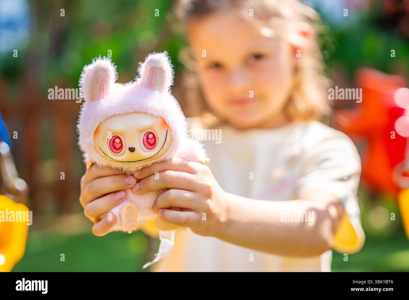 Budva, Montenegro - June 12, 2025: Little girl proudly showing pink ...