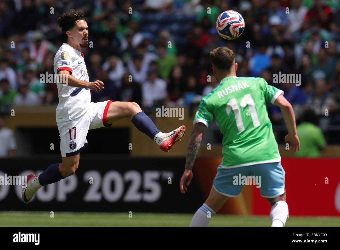 Paris Saint-Germain's Vitinha, left, controls the ball as Seattle ...