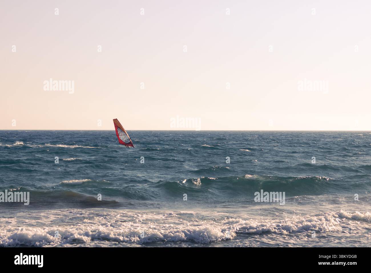 Limassol, Cyprus. 06-20-2025. A person doing wind surfing at Koureion ...