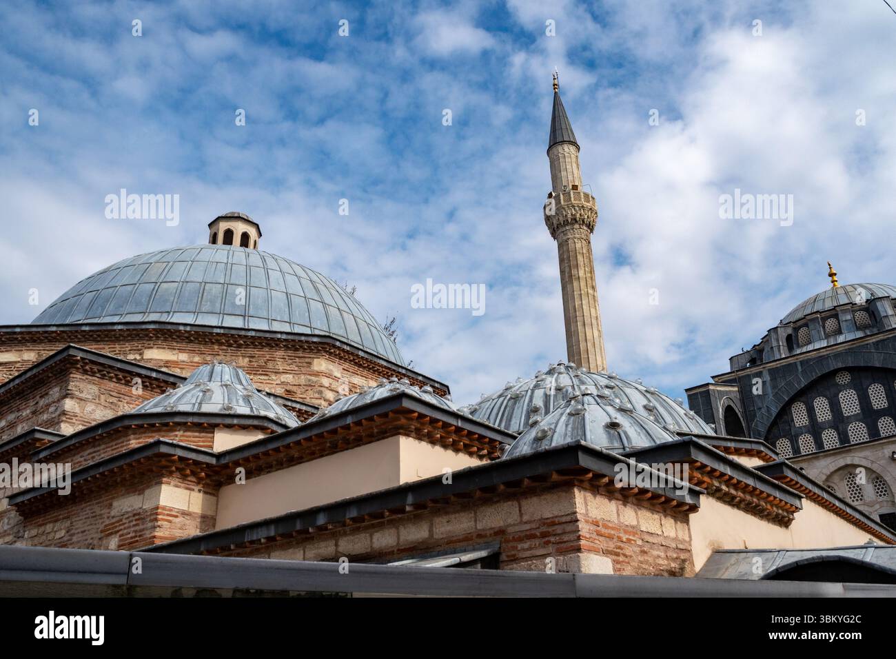A low-angle shot showcases the architectural details of a mosque ...