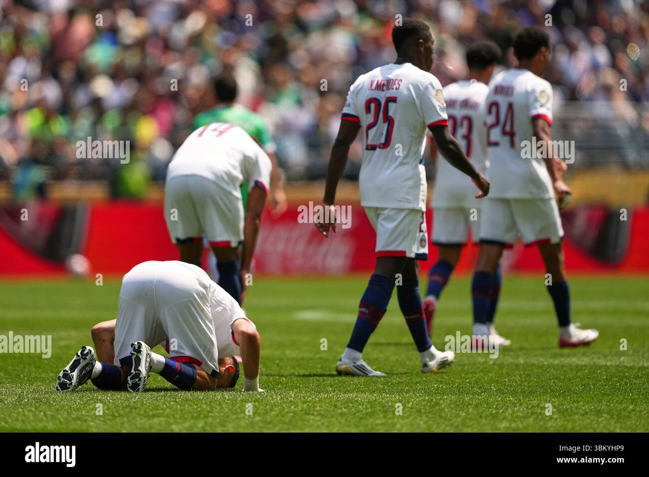 Paris Saint-Germain's Achraf Hakimi kisses the turf after scoring his ...