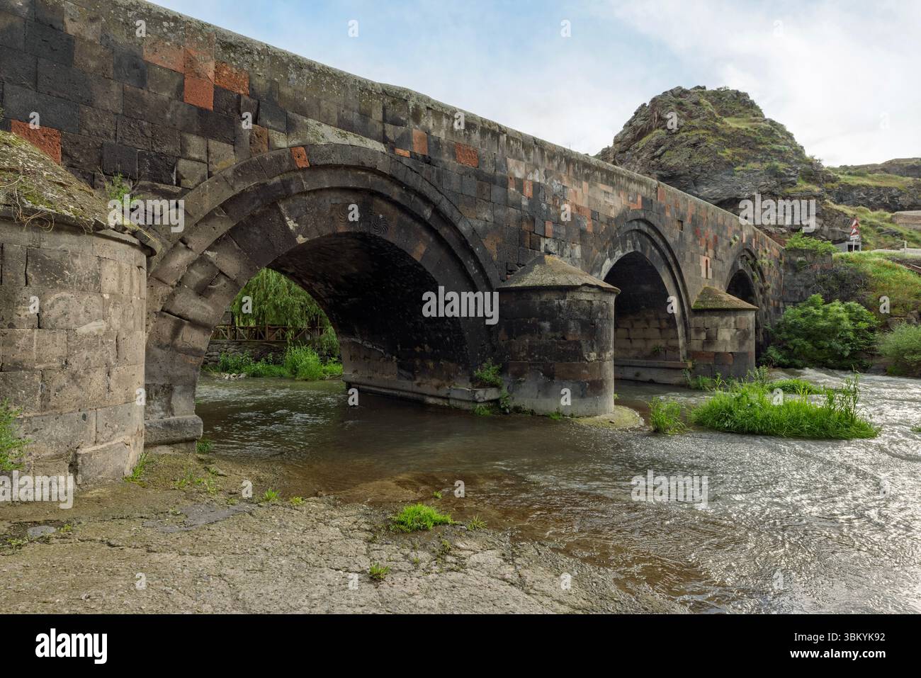 The five-arched Oshakan bridge, built from red tuff in 1706, elegantly ...