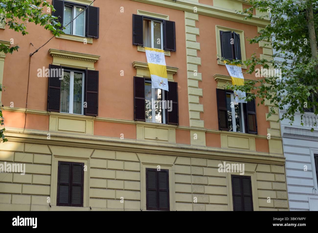Rome, Italy. 22nd June, 2025. Flags of the Vatican State hung from the ...