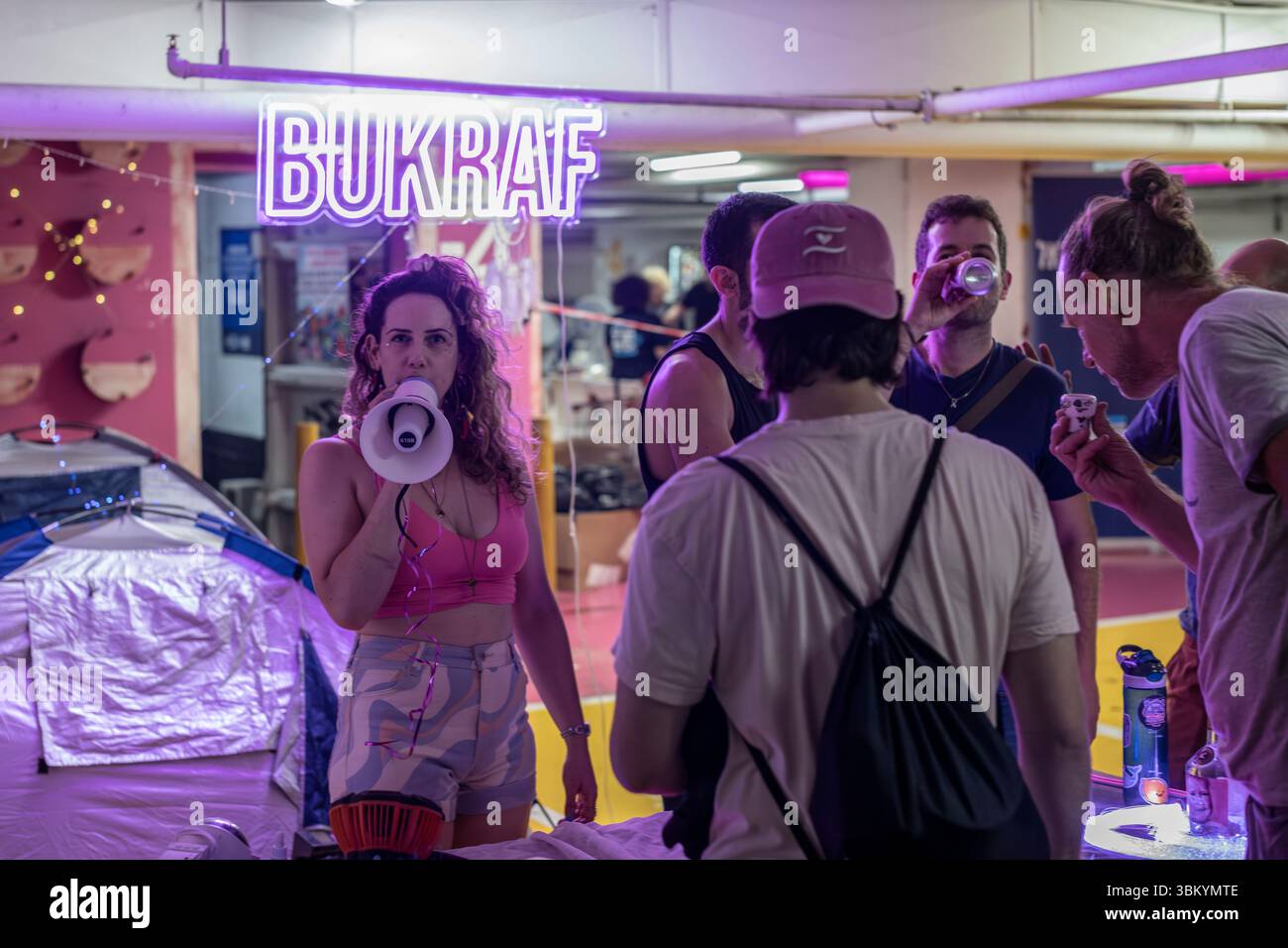 Tel Aviv, Israel. 23rd June, 2025. Israelis dance during a party in an ...