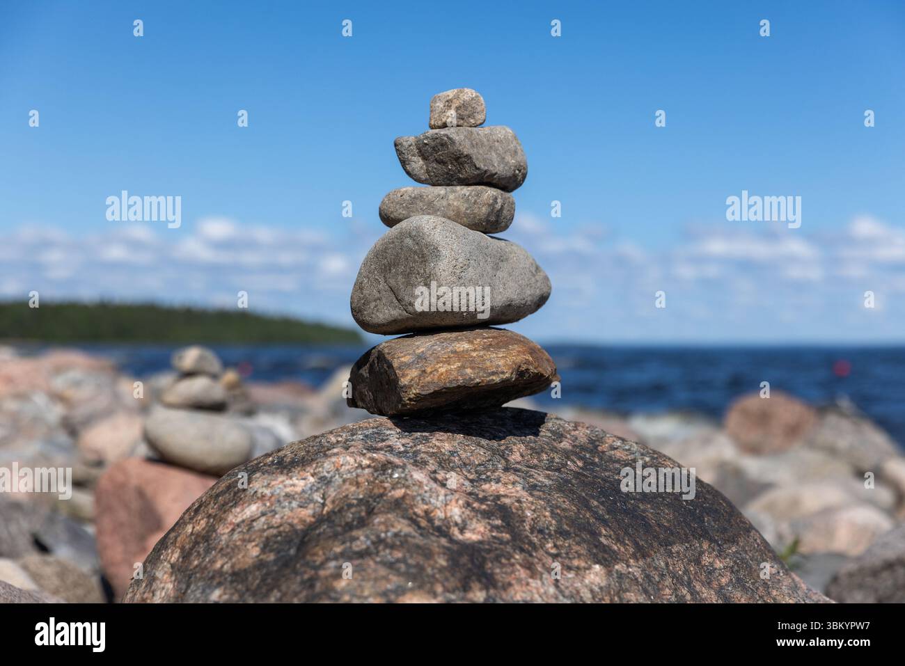 Calm and meditation inspired by a balanced stone stack on a beachfront ...