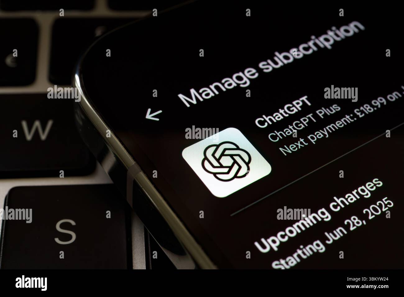 Smartphone showing ChatGPT Plus subscription screen with keyboard in ...