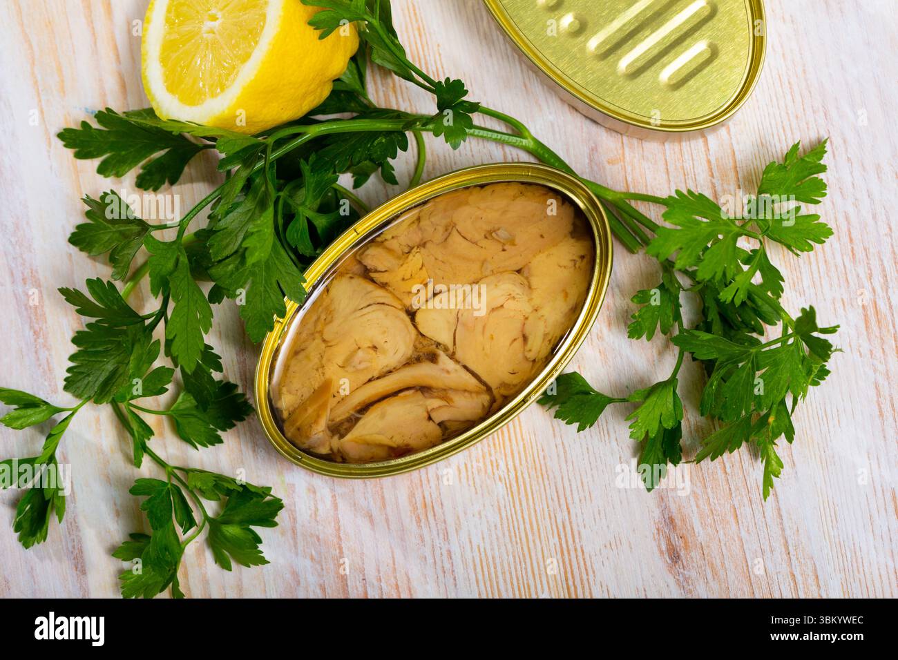 Open tin can of tuna in oil Stock Photo - Alamy